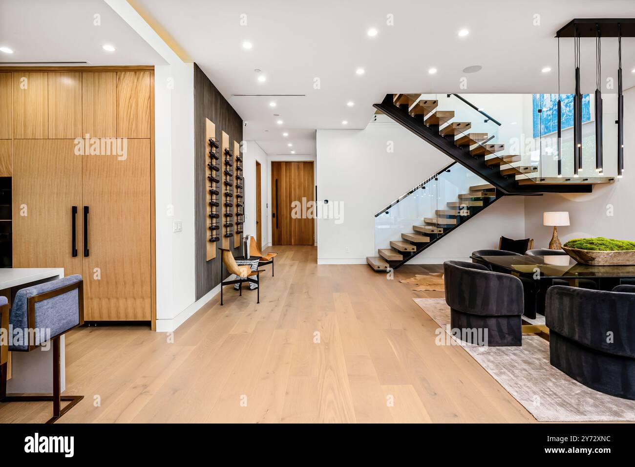 Modern interior of a luxury home with open space living area, wooden ...