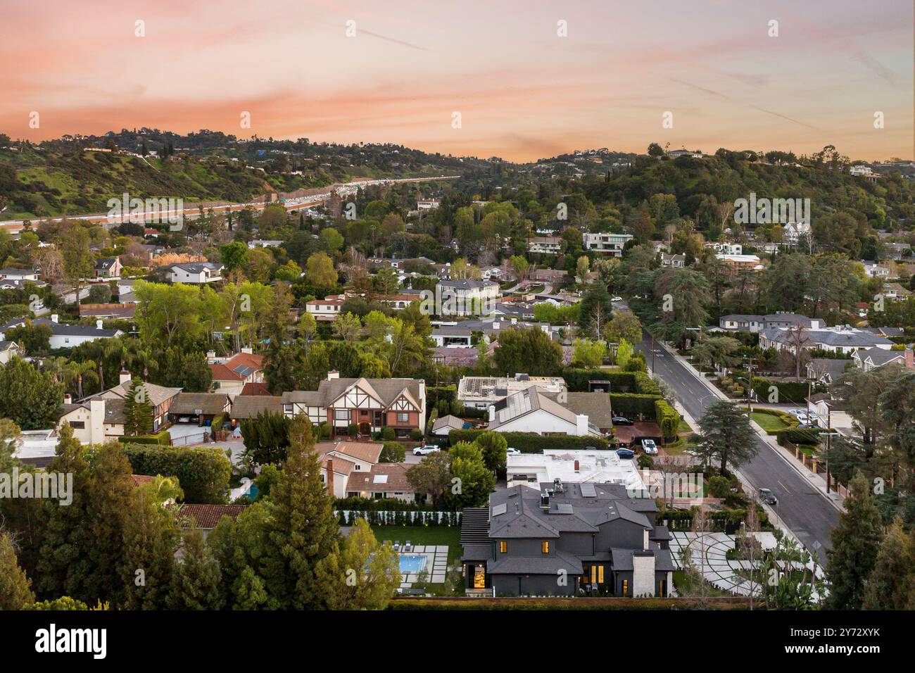 Aerial view of a suburban neighborhood with houses and greenery during ...