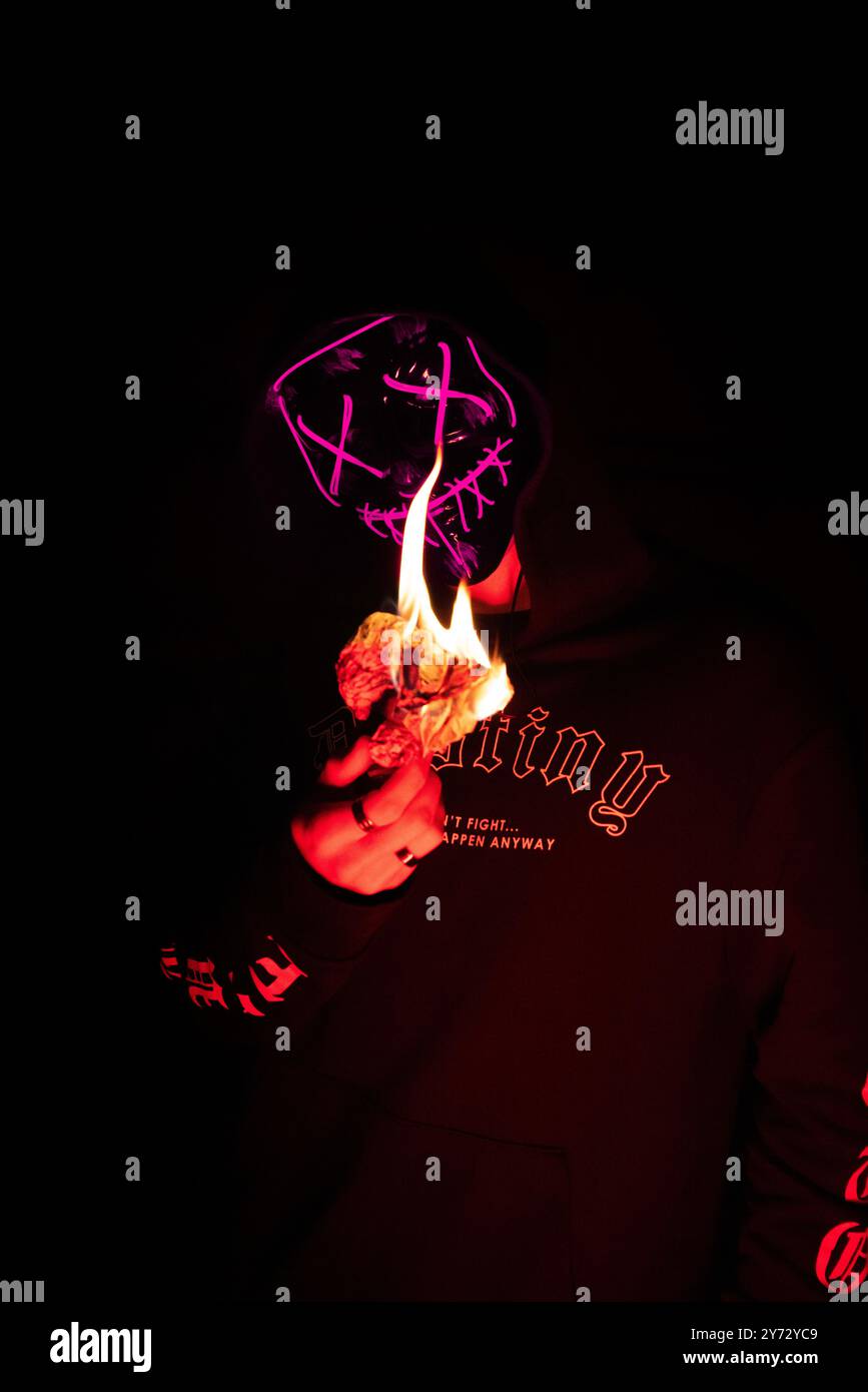 A creepy masked character of the purge anarchy with a baseball bat ...