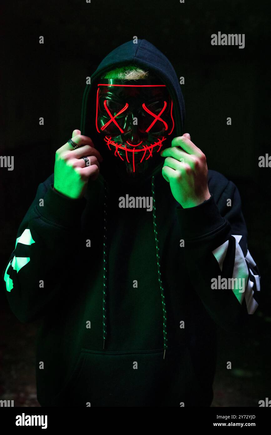 A creepy masked character of the purge anarchy with a baseball bat ...