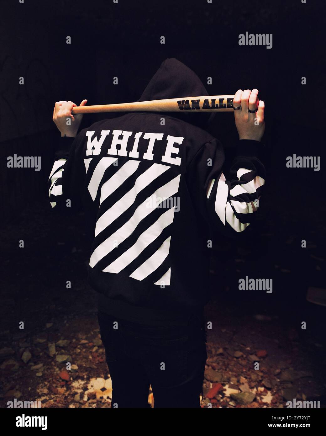 A creepy masked character of the purge anarchy with a baseball bat ...