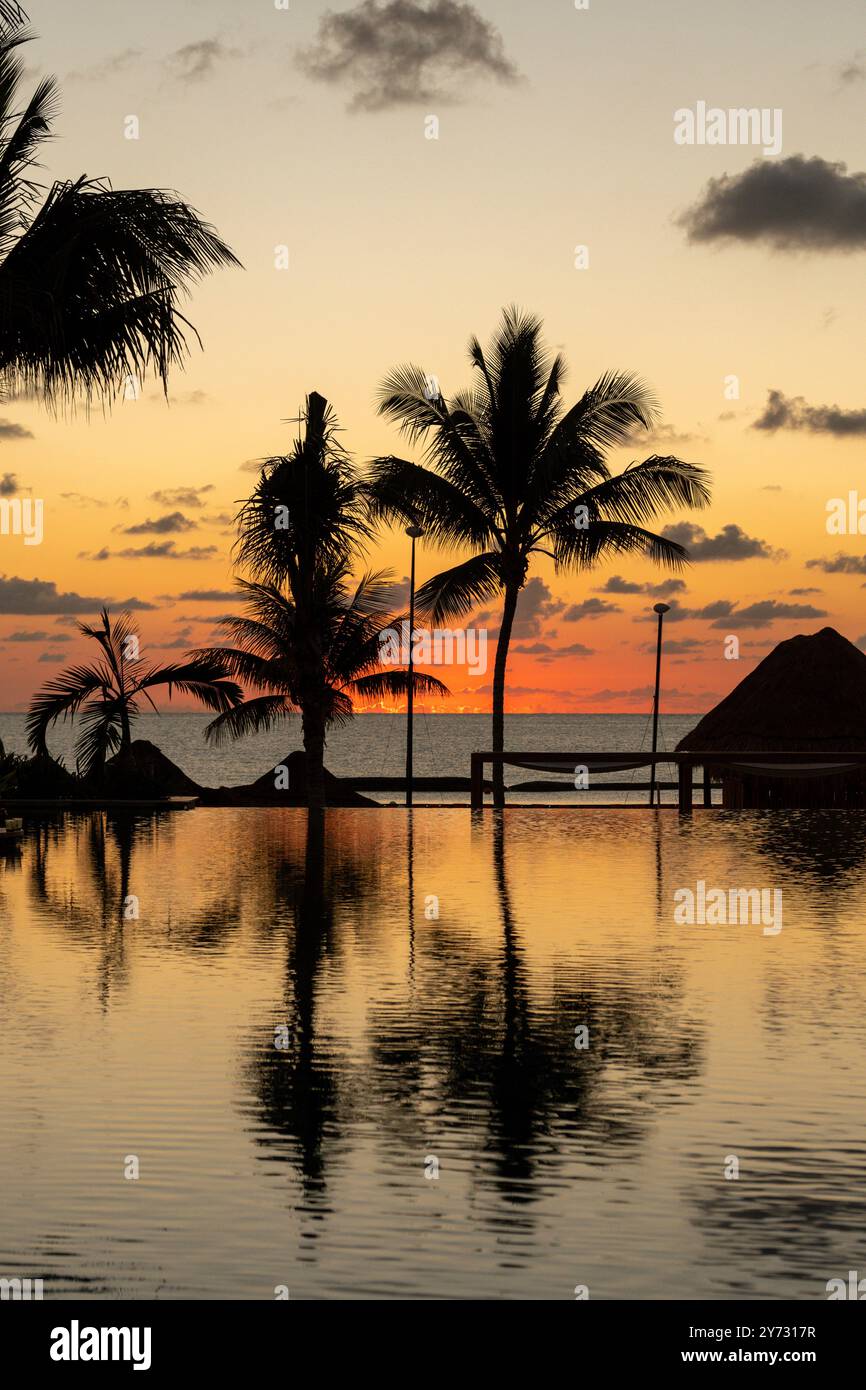 Sunrise over the Gulf of Mexico reflected into the infinity pool at the ...
