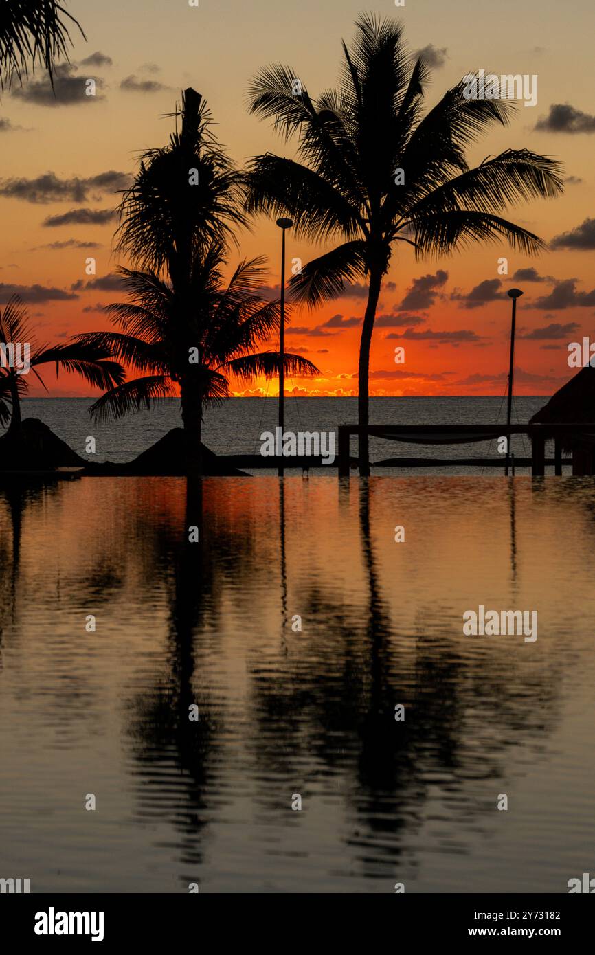 Sunrise over the Gulf of Mexico reflected into the infinity pool at the ...