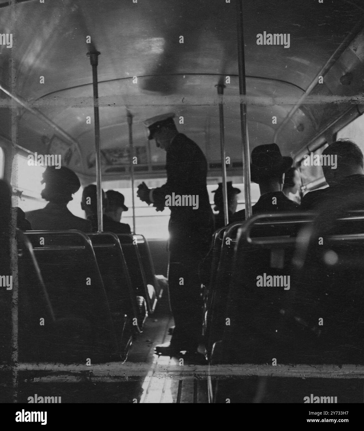 London bus service conductor checking passengers tickets 1946 Stock ...