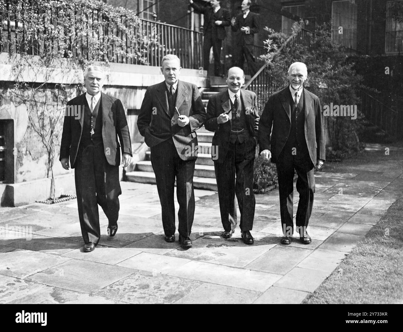 Photo shows left to right: Mr Walter Nash, Mr J.B. Chifley, Mr C.R. Attler and General Smuts ...