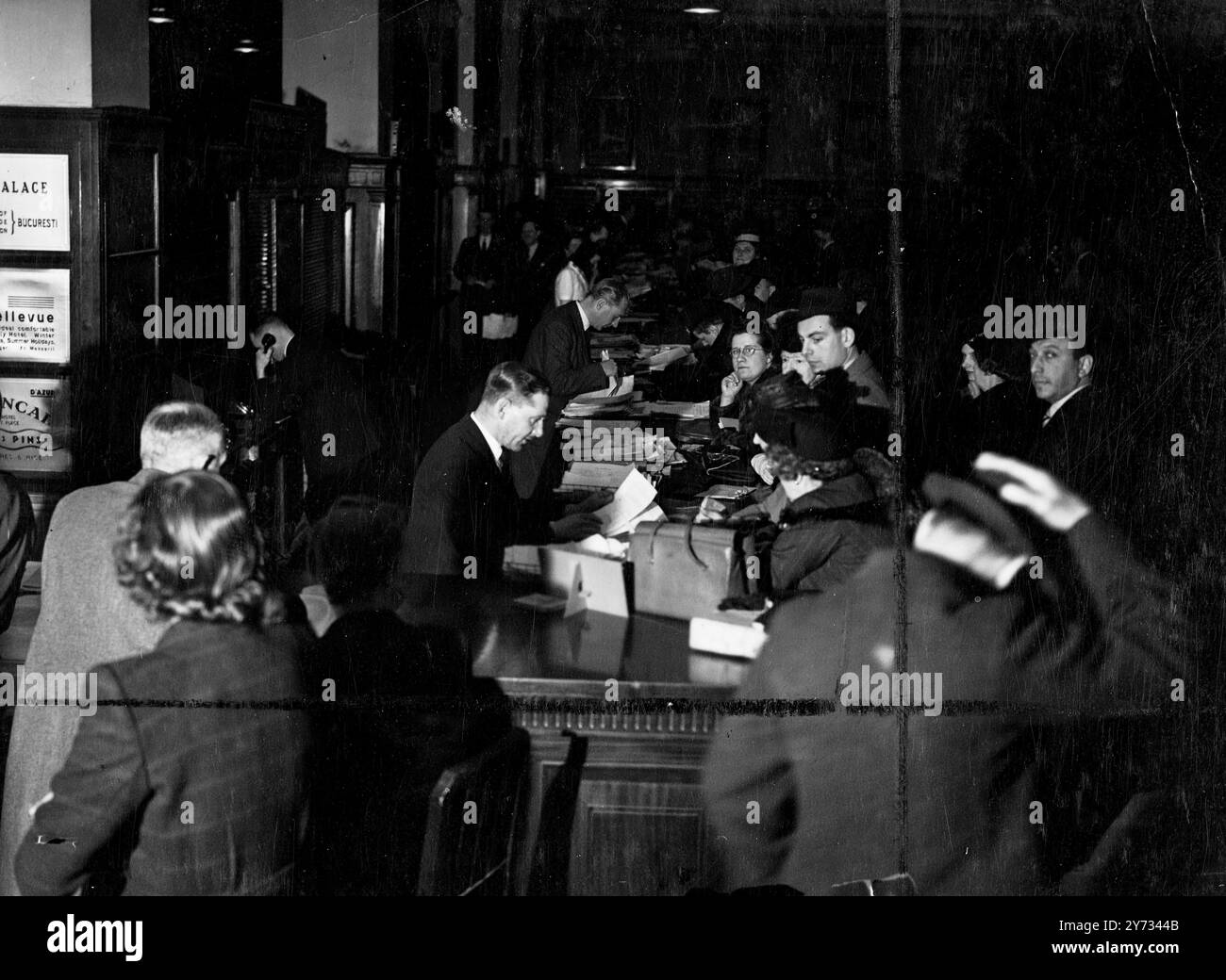 Customers with agents at Thomas Cook 's Travel Agency, London.1946 ...