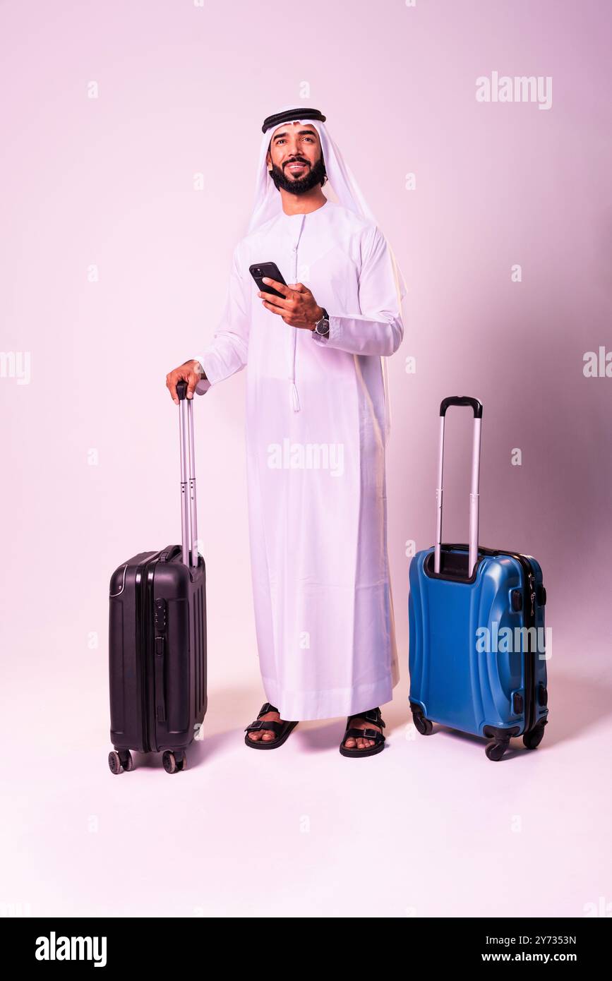 Arab businessman wearing emirati kandura portrait in studio in Dubai ...