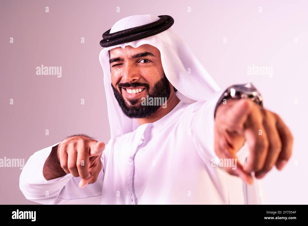Arab businessman wearing emirati kandura portrait in studio in Dubai ...