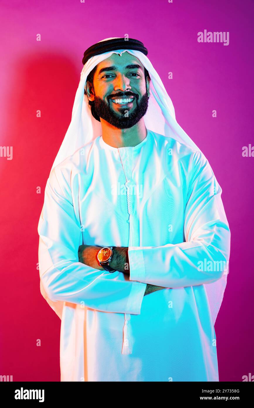 Arab businessman wearing emirati kandura portrait in studio in Dubai ...