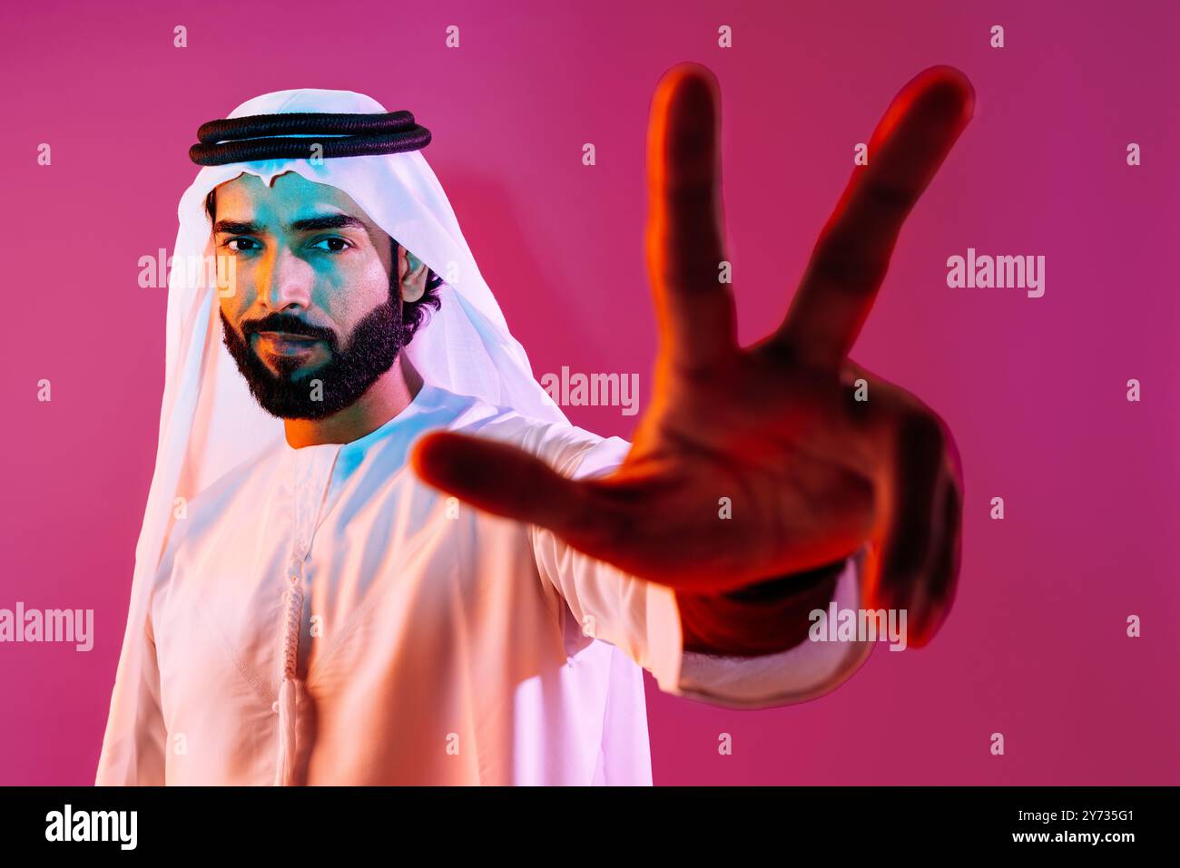 Arab businessman wearing emirati kandura portrait in studio in Dubai ...