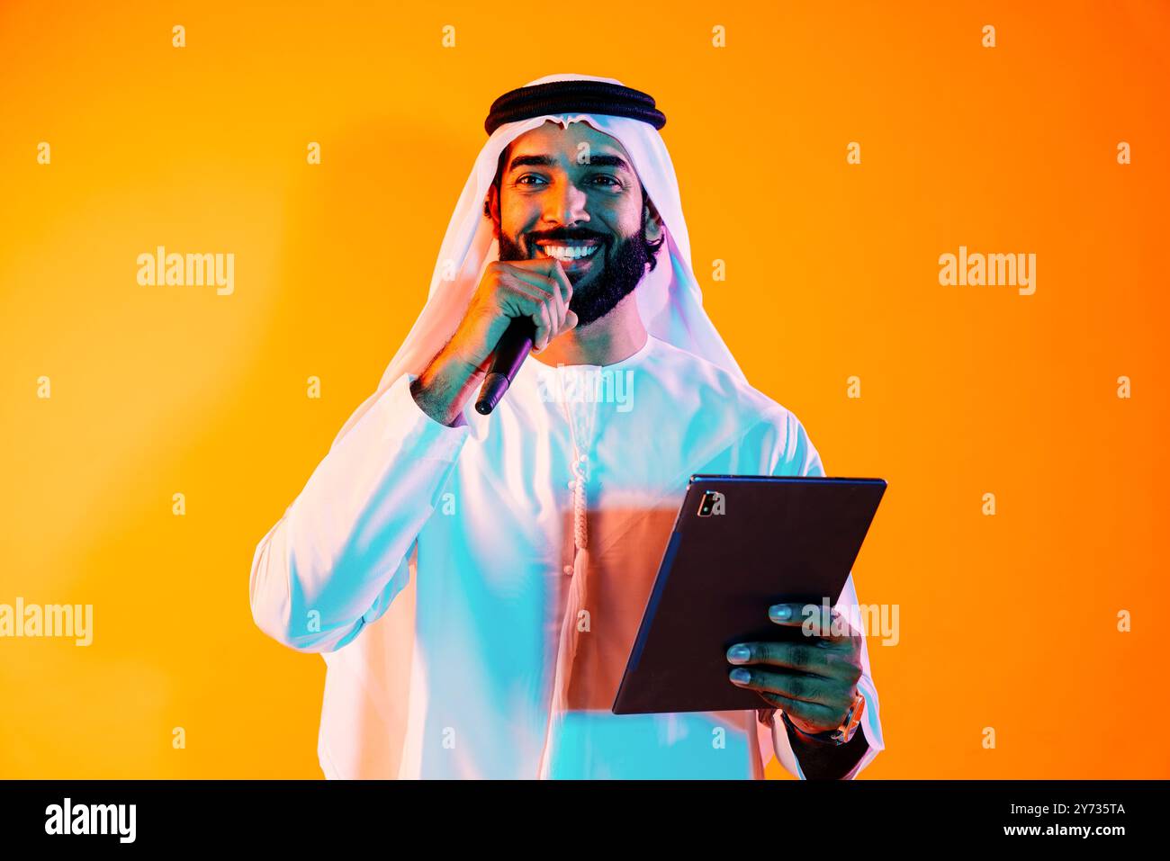 Arab businessman wearing emirati kandura portrait in studio in Dubai ...