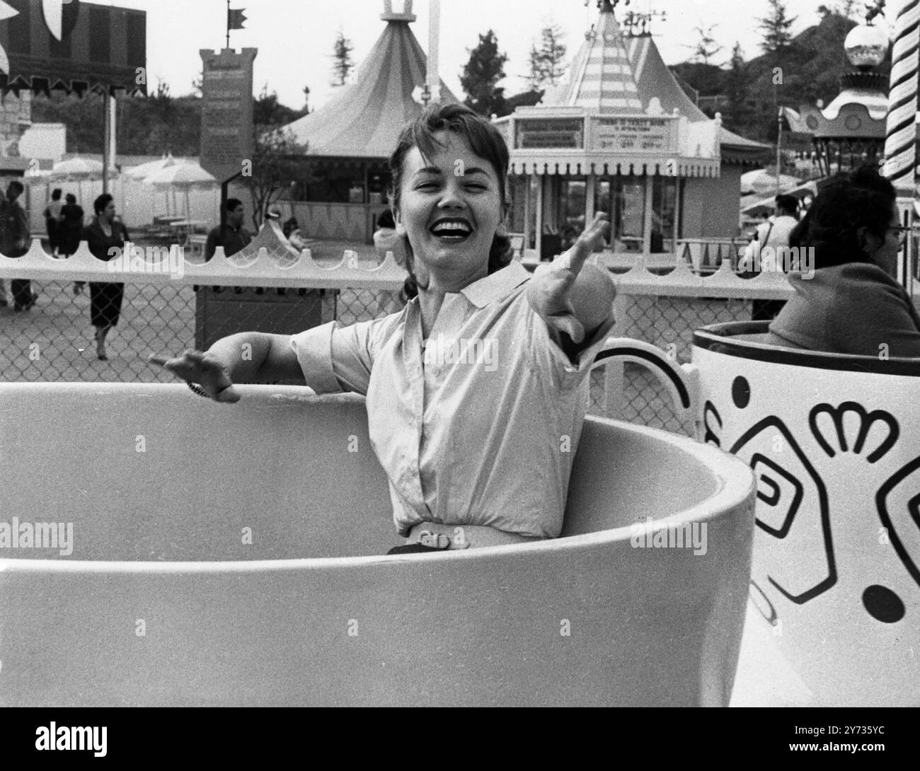 Enjoying herself in Hollywood 's own playground , Disneyland , is Swiss ...