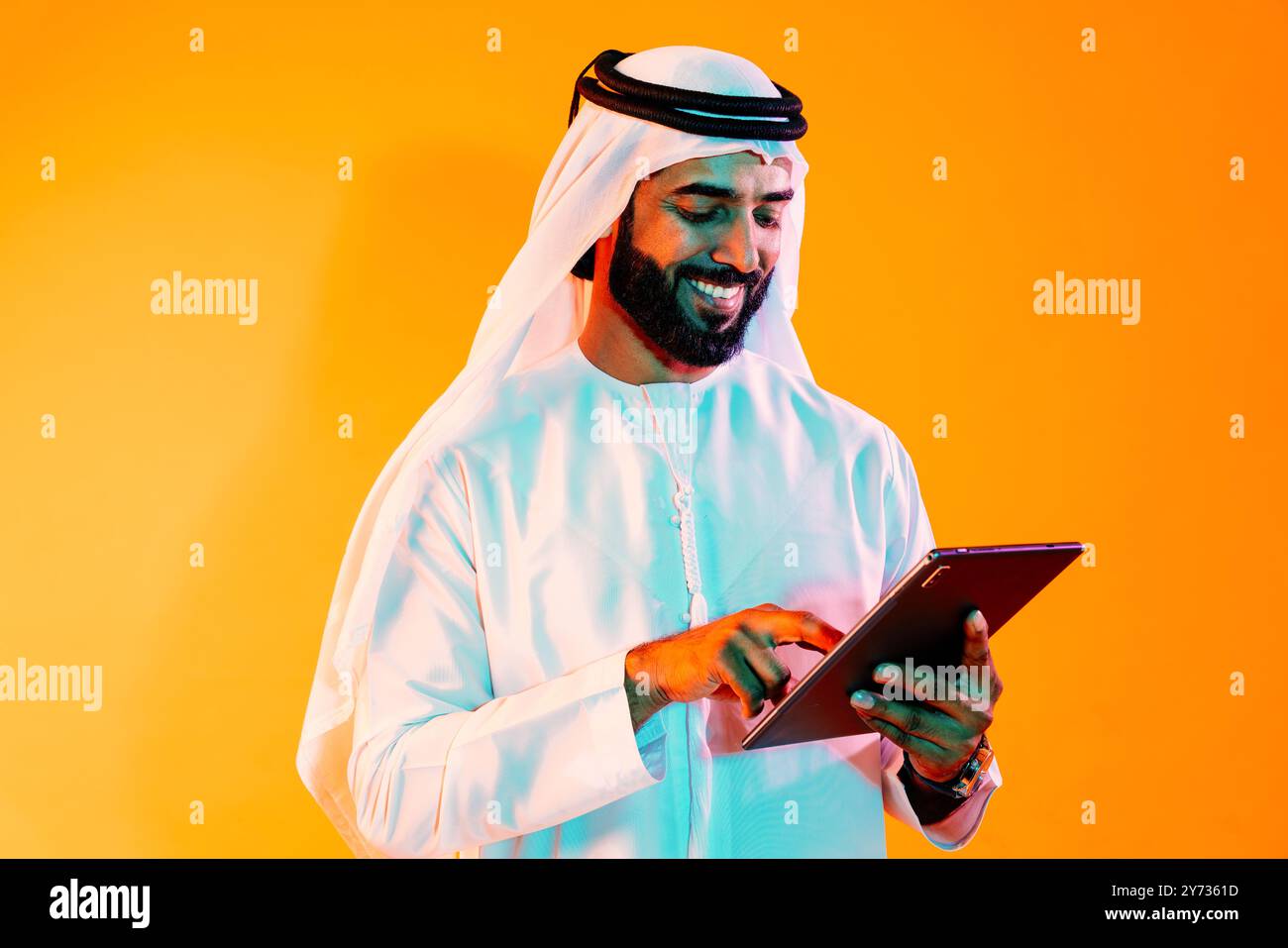 Arab businessman wearing emirati kandura portrait in studio in Dubai ...