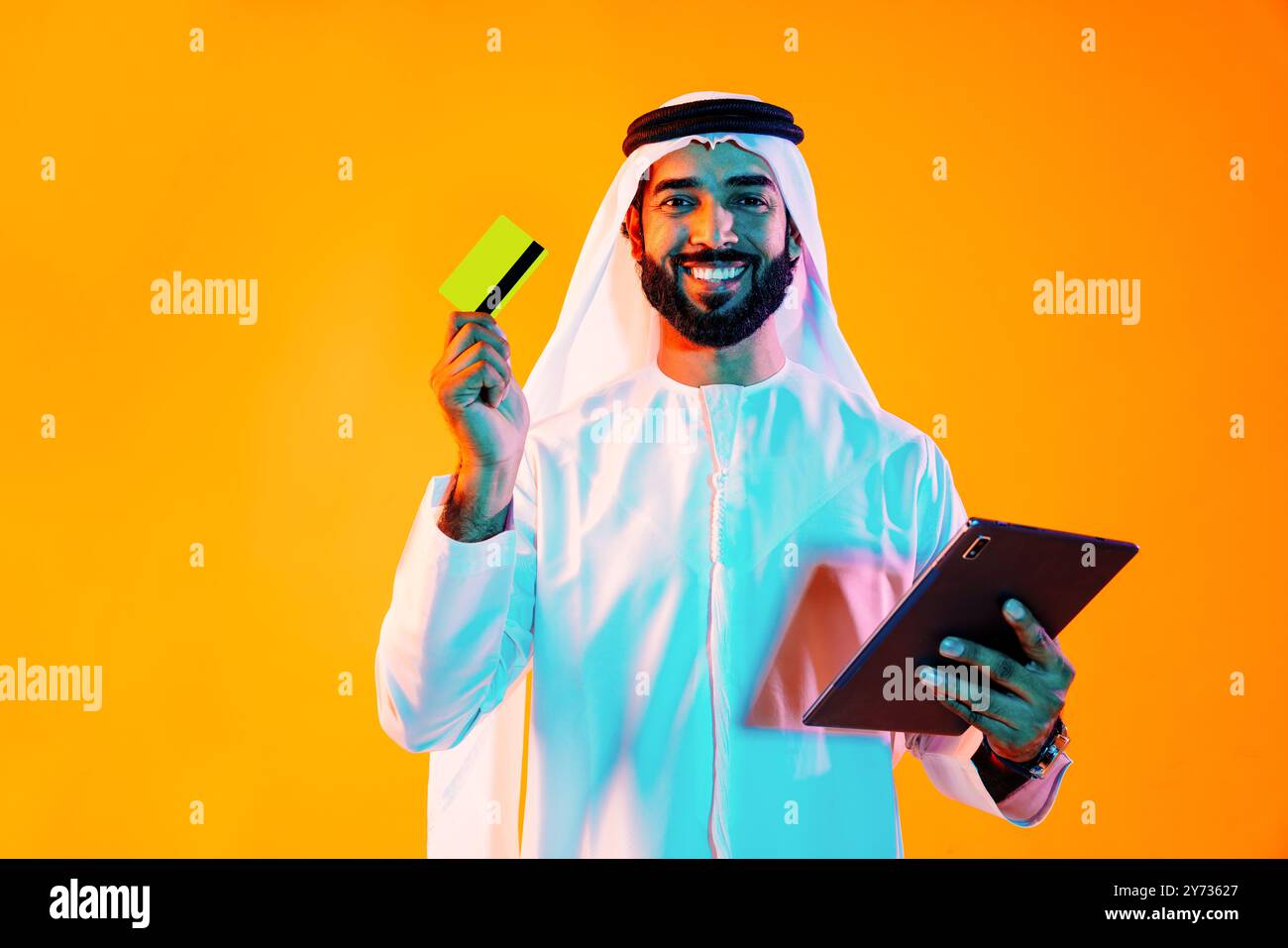 Arab businessman wearing emirati kandura portrait in studio in Dubai ...