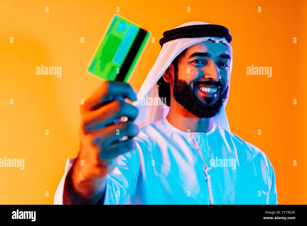 Arab businessman wearing emirati kandura portrait in studio in Dubai ...