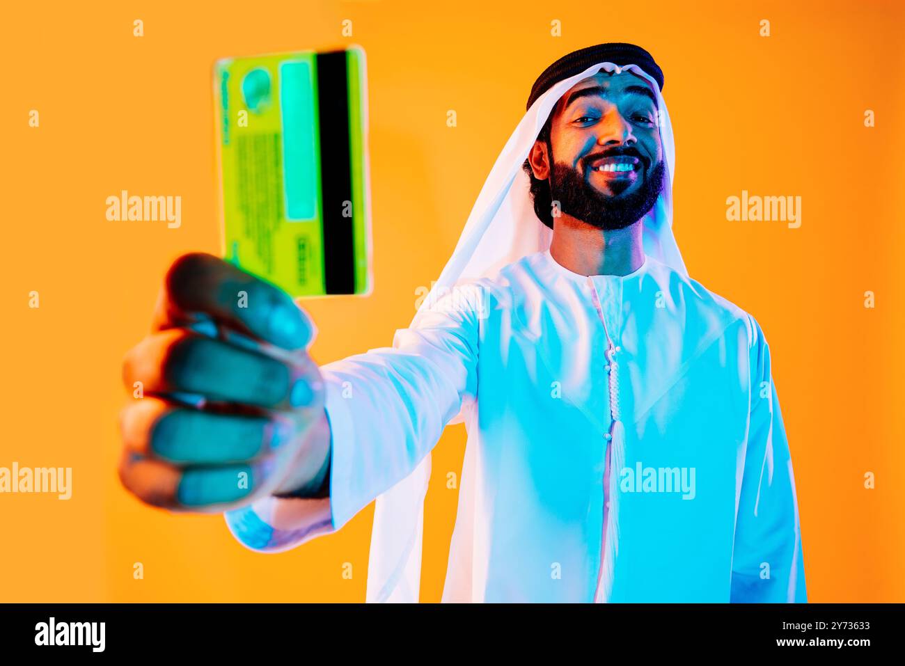 Arab businessman wearing emirati kandura portrait in studio in Dubai ...