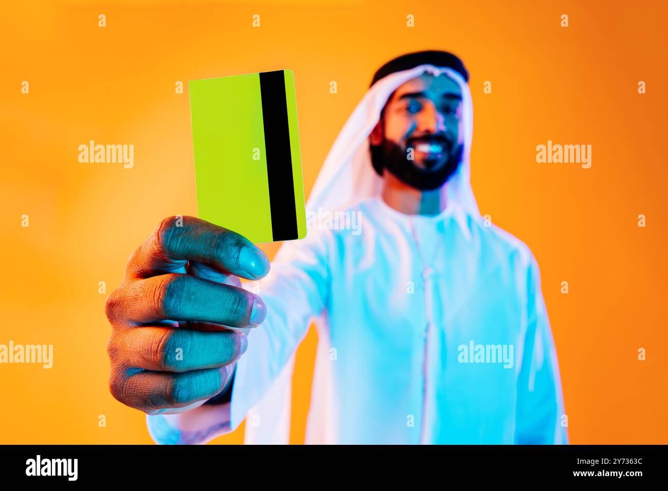 Arab businessman wearing emirati kandura portrait in studio in Dubai ...