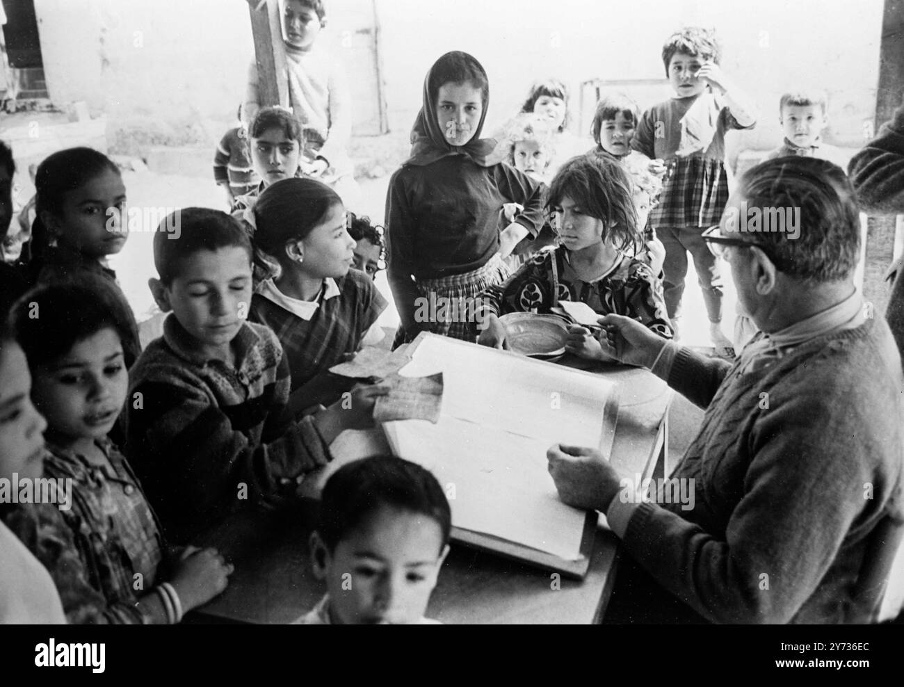 Lebanon , Beirut ; Refugee children line up with their ration cards to ...