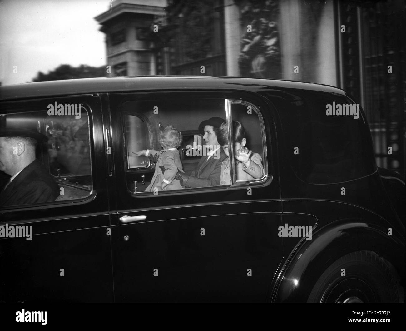 Nurse Helen Lightbody holds Princess Anne , and Prince Charles amuses ...