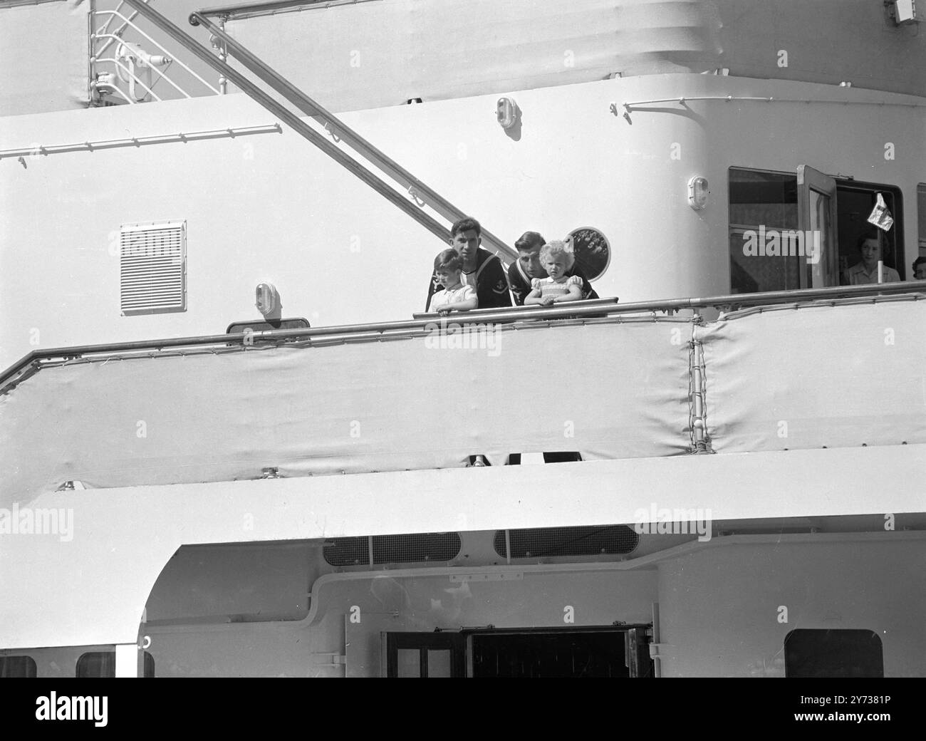 Prince Charles and Princess Anne watch with keen interest from the deck ...