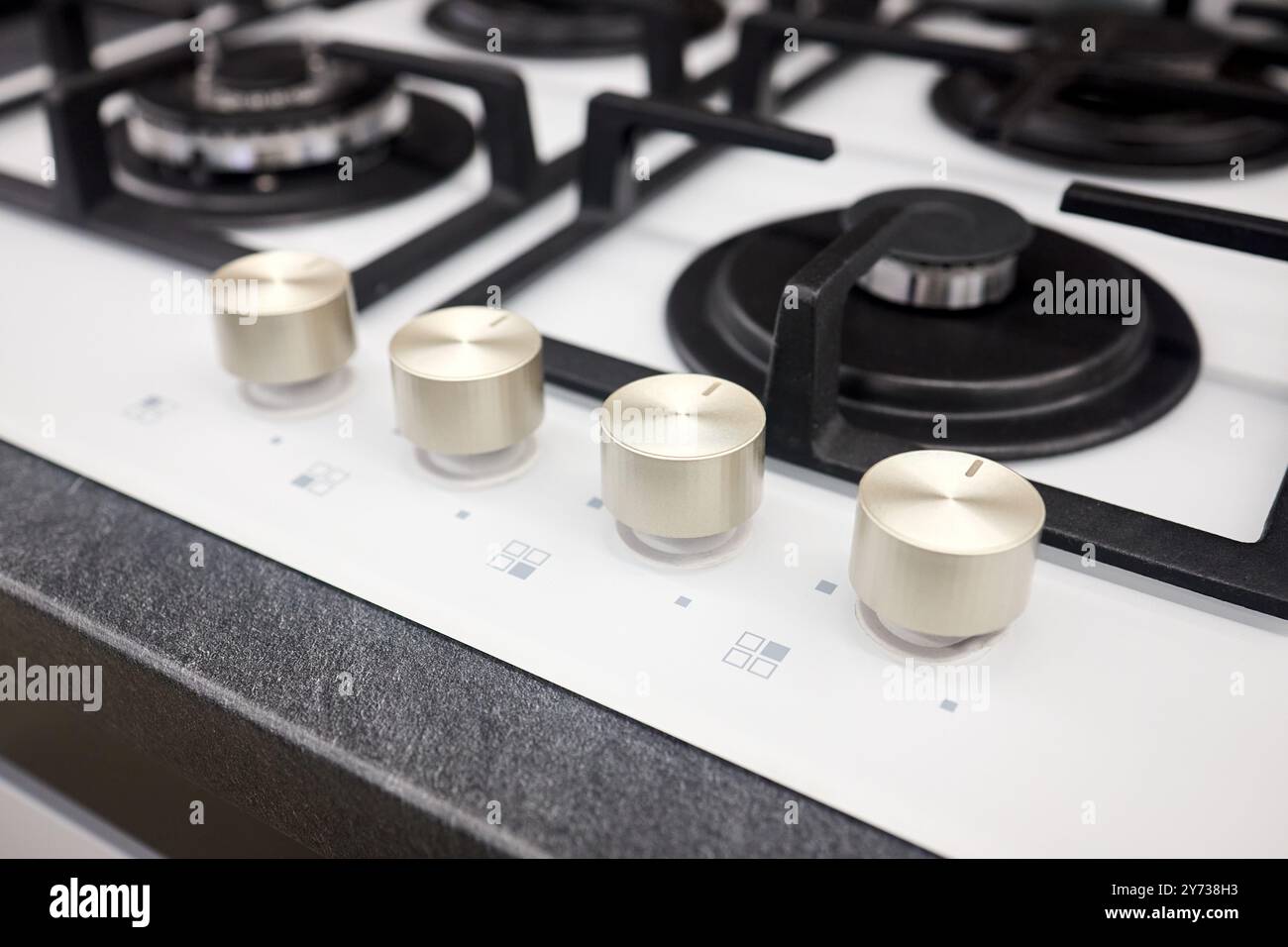 White hob cooker oven grill control knobs selective focus over out of ...