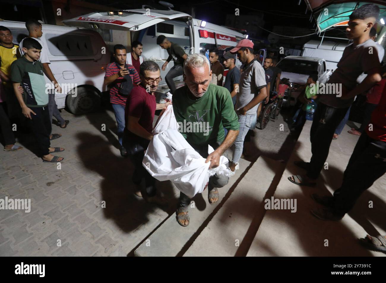 Relatives of Palestinians, who lost their lives in an Israeli attack on ...