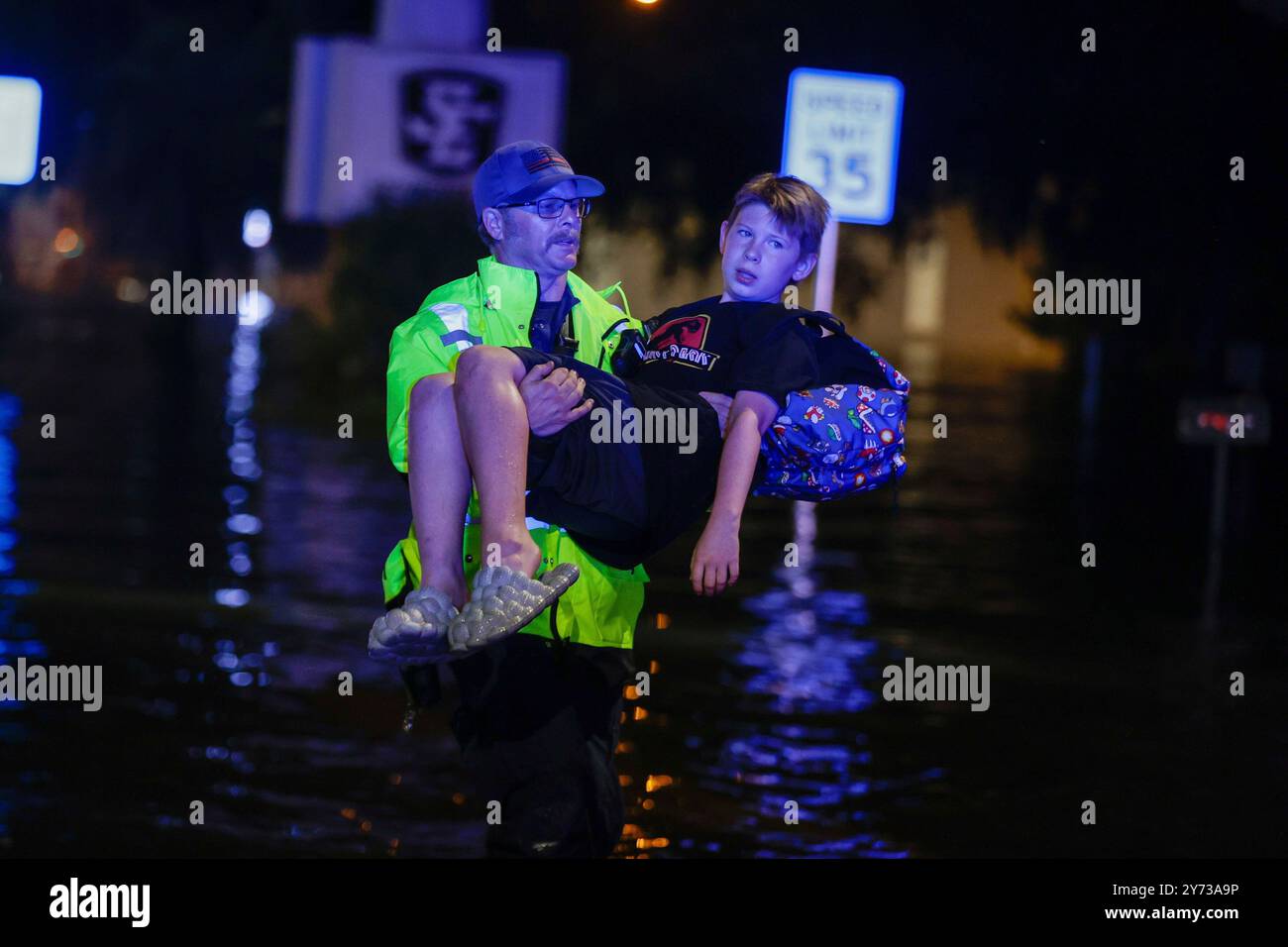 A Citrus County Firefigher carries 11-year- old, Michael Cribbins ...