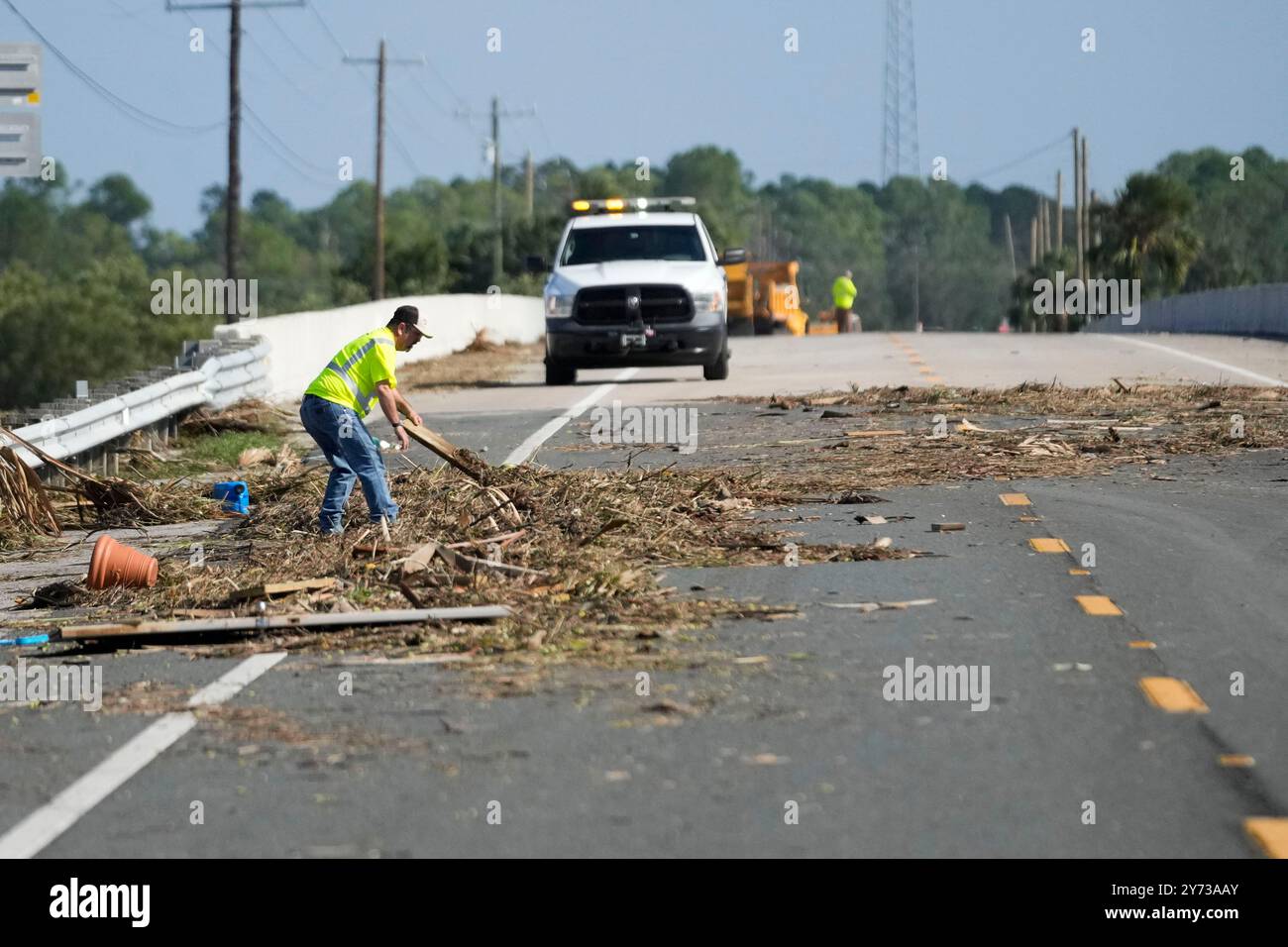 Workers remove debris in the aftermath of Hurricane Helene, in Cedar ...