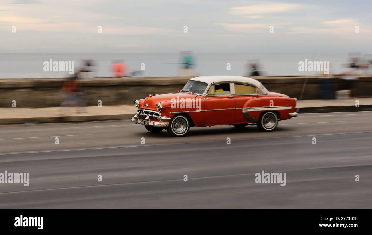 741 Old copper-red American classic car -Chevrolet 1954- driving on The ...