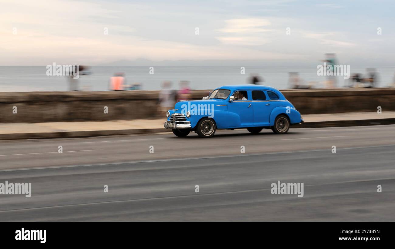 744 Old azure-blue American classic car -Chevrolet 1947- driving on The ...