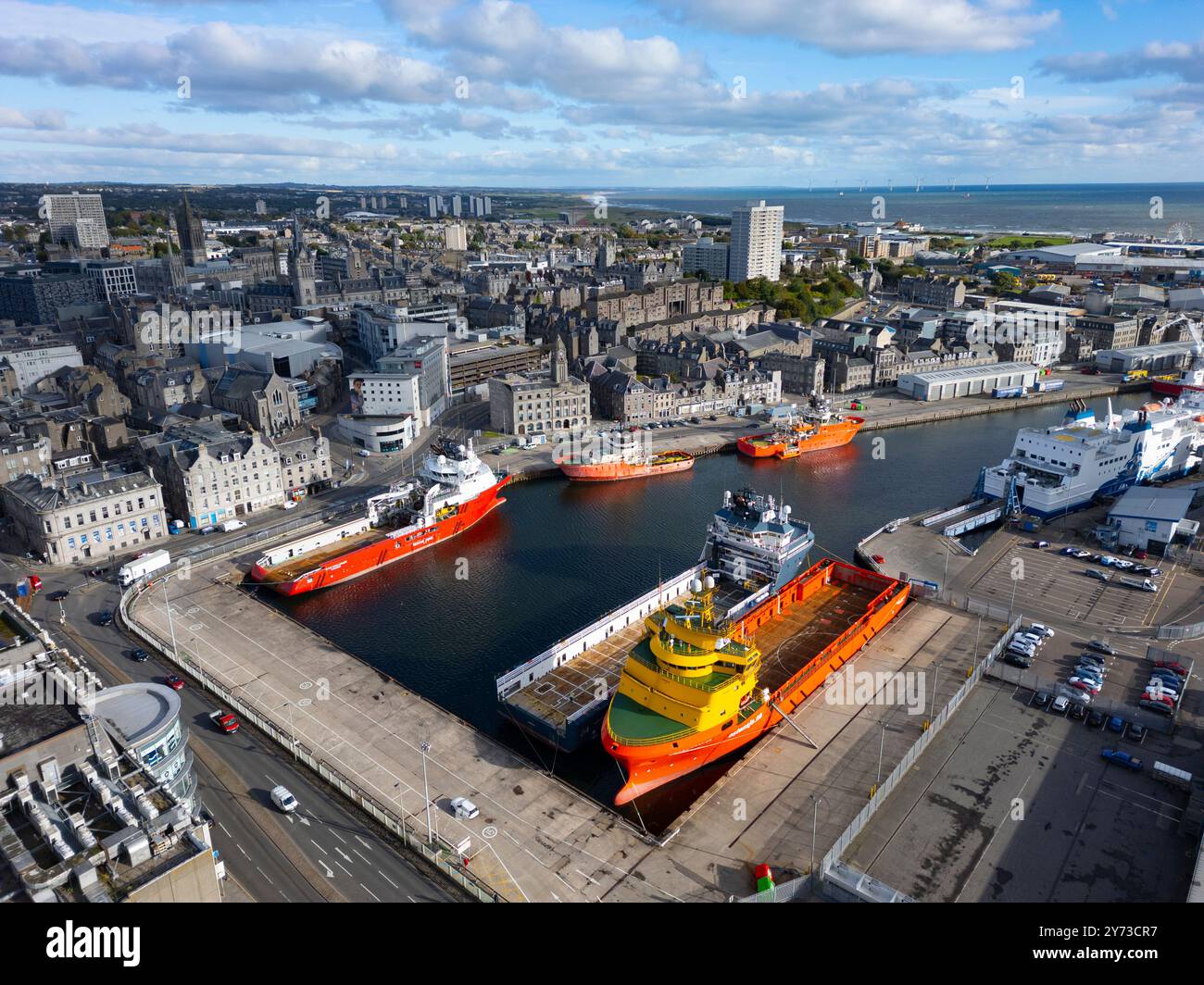 Aerial view from drone of ships in harbour and city skyline in Aberdeen ...