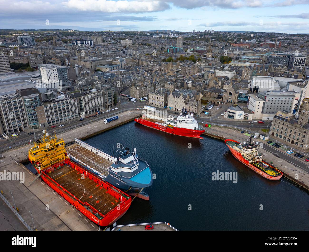 Aerial view from drone of ships in harbour and city skyline in Aberdeen ...