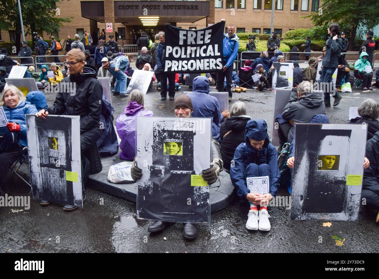 London, UK. 27th Sep, 2024. Protesters holding pictures of numerous ...