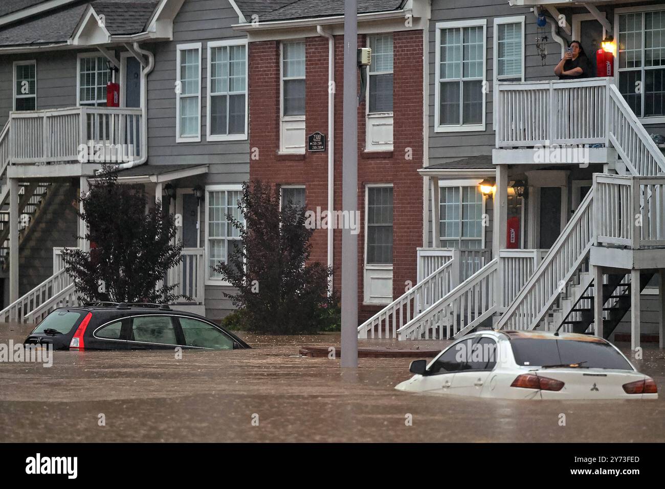 Atlanta, Georgia, USA. 27th Sep, 2024. Vehicles sit in flood waters ...