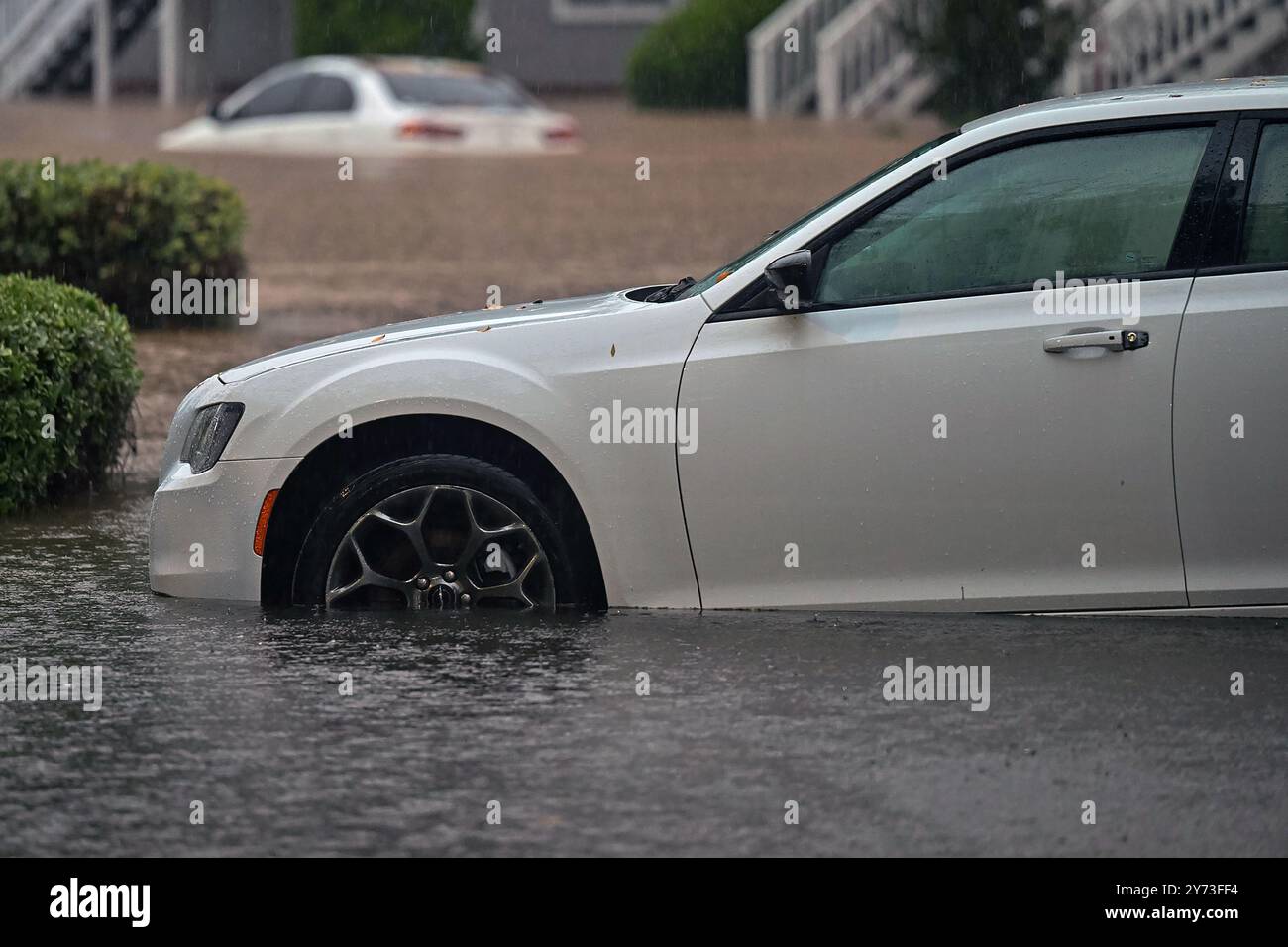 Atlanta, Georgia, USA. 27th Sep, 2024. Flood surge traps cars and ...