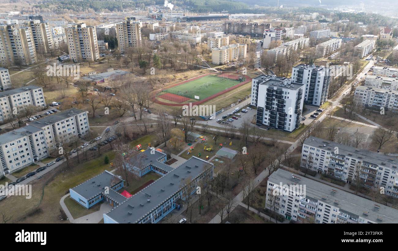 Aerial view of a modern urban area featuring a mix of residential and ...