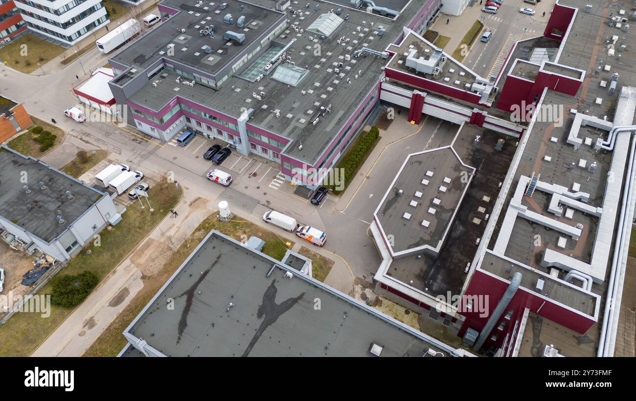 An aerial view of a modern hospital featuring several buildings with ...