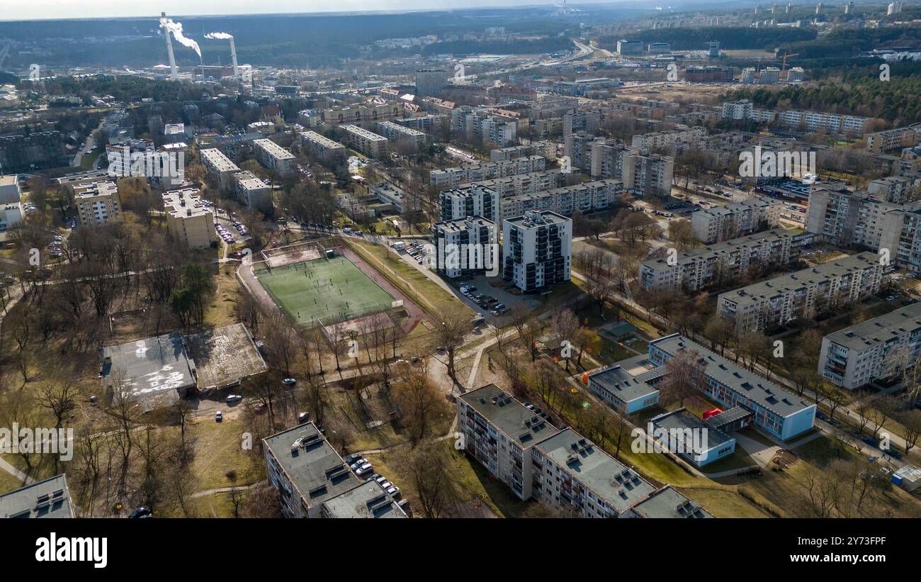 Aerial view of a modern urban area featuring a mix of residential and ...