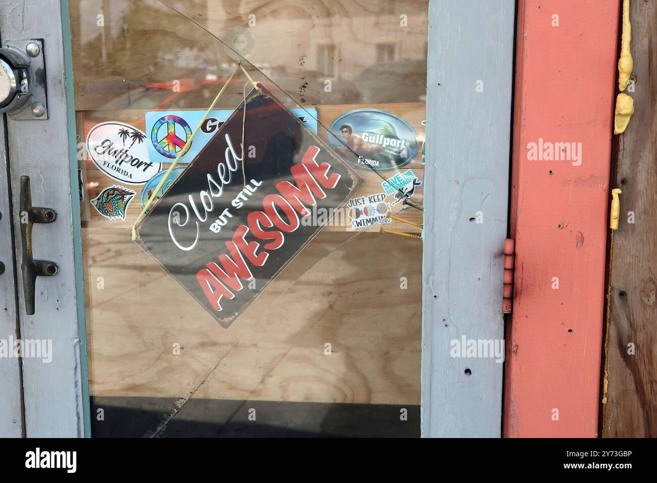 A sign in a closed and boarded business after Hurricane Helene on ...