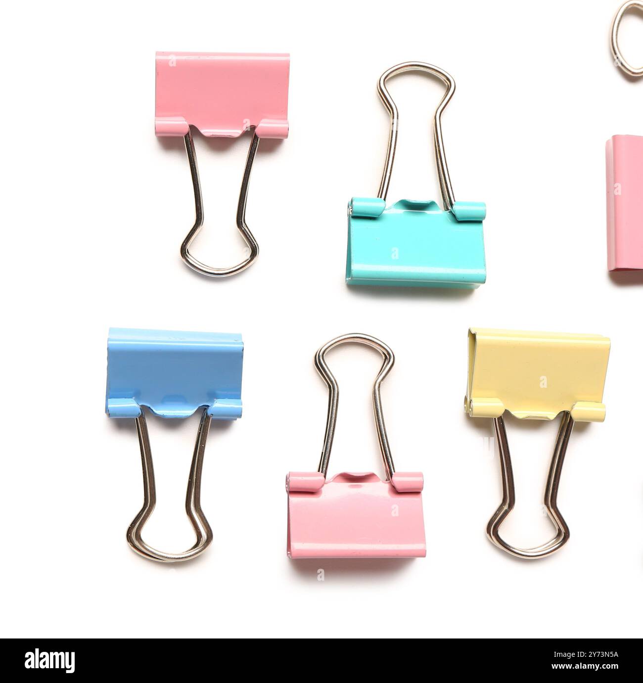 Colorful binder clips on white background Stock Photo - Alamy