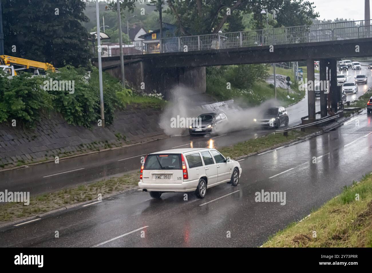 Gothenburg, Sweden - June 07 2022: Cars driving through deep water in a ...