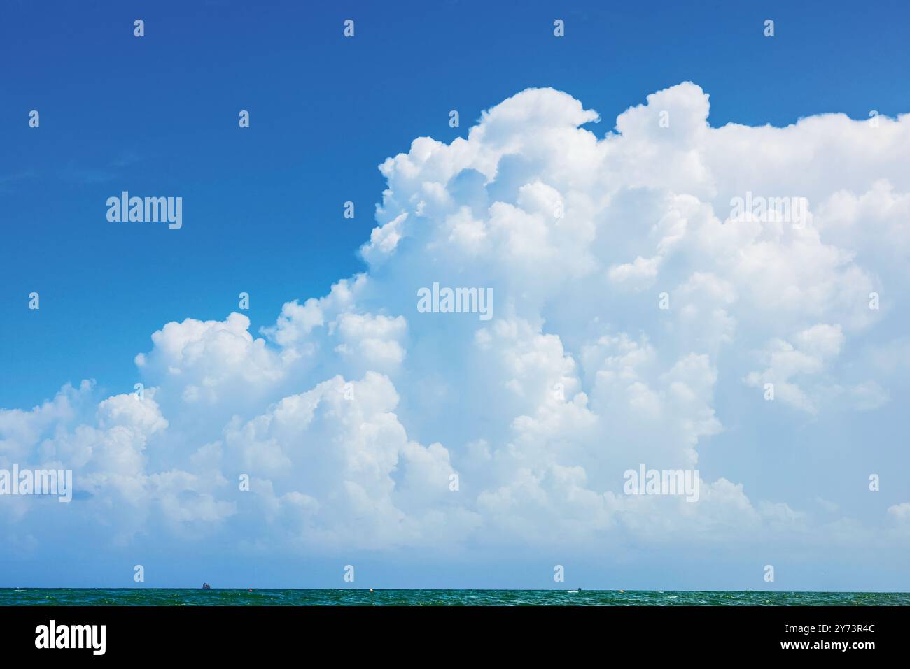 Cumulus clouds rise above horizon of Atlantic Ocean near Miami Beach on clear day Stock Photo ...