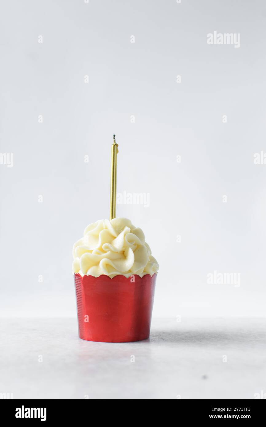 red cupcakes with tall buttercream swirl, cupcakes in red foil liners ...