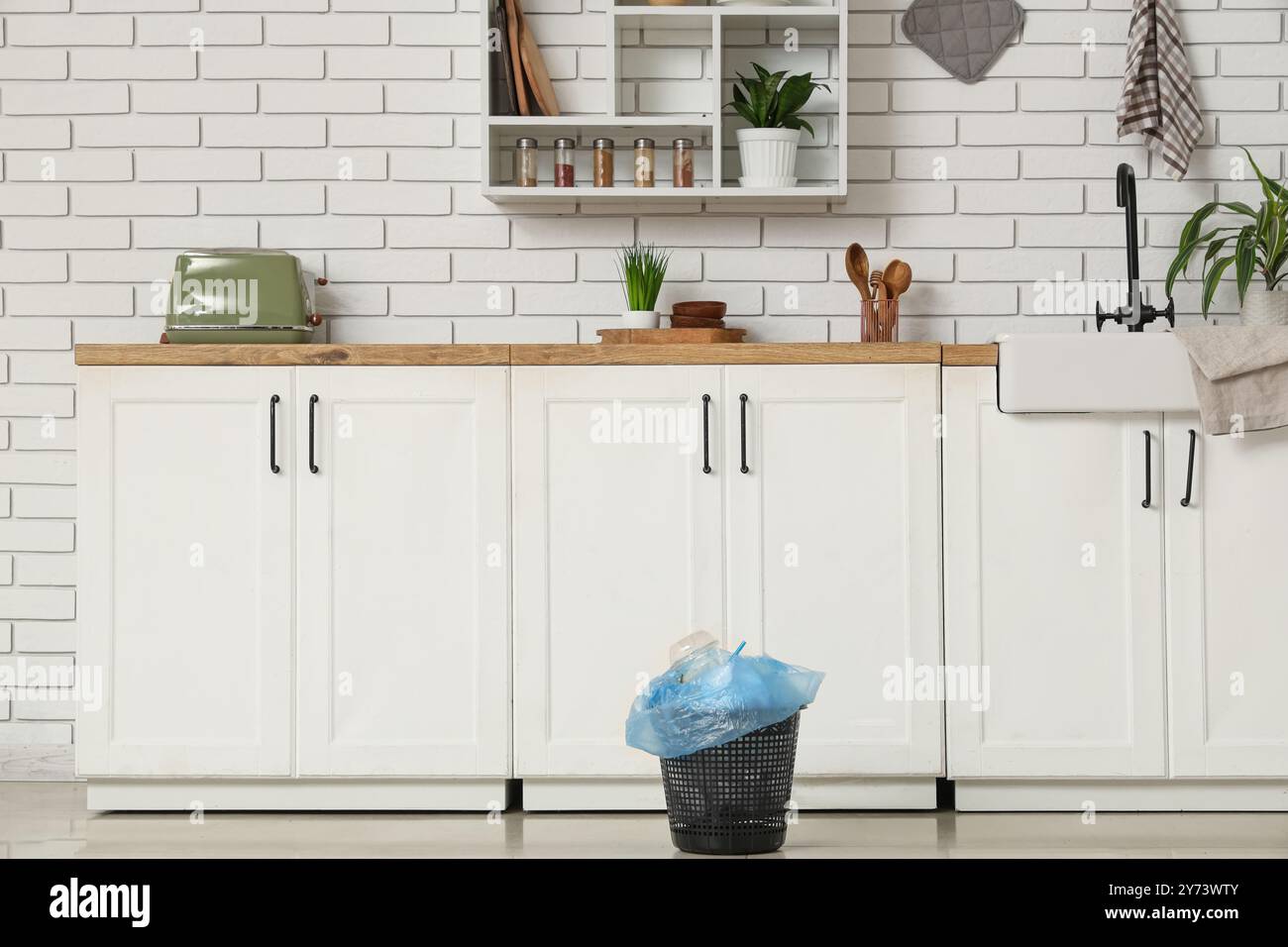 Full trash can in kitchen hi-res stock photography and images - Alamy