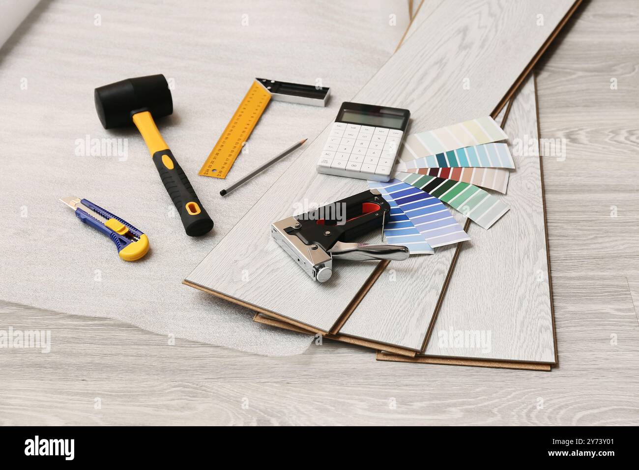 Tools, calculator, house project, color palettes and laminate boards on ...