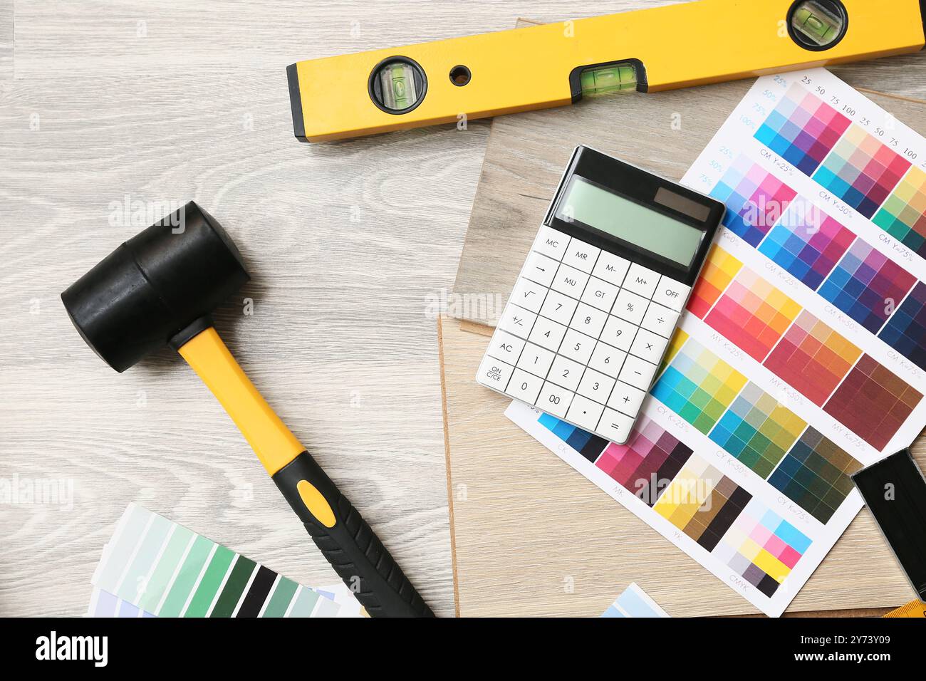 Tools, calculator, color palettes and laminate boards on floor Stock ...