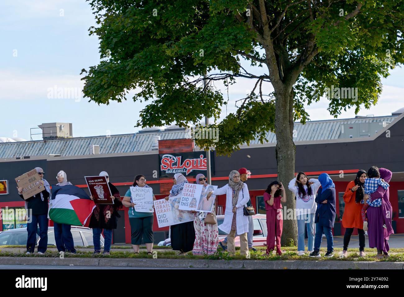 Saint John, NB, Canada - August 31, 2024: Protestors alongside the road ...