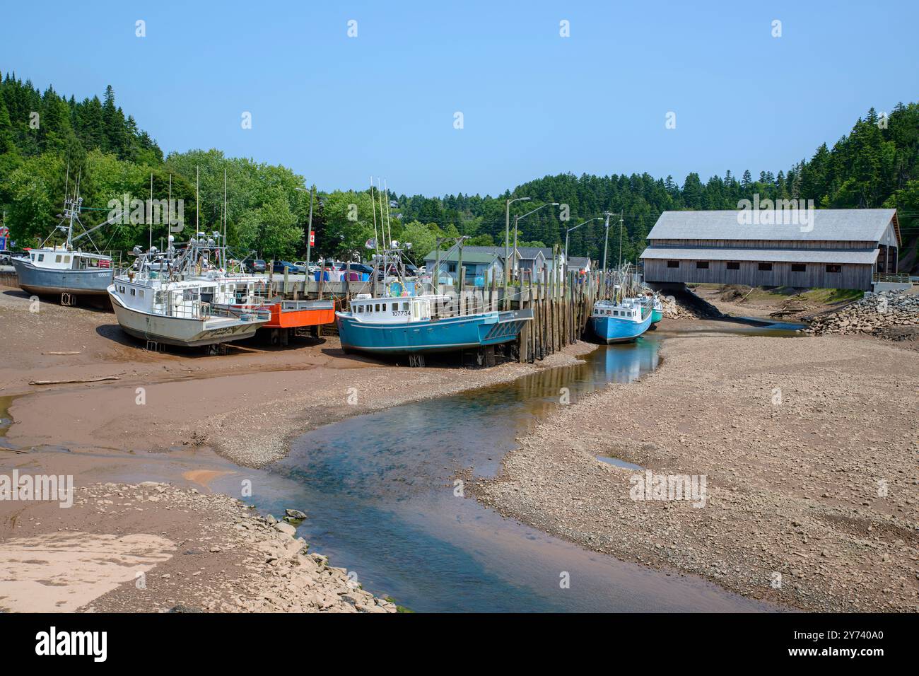 St. Martins, NB, Canada - July 28, 2024: Fishing boats rest in mud at ...