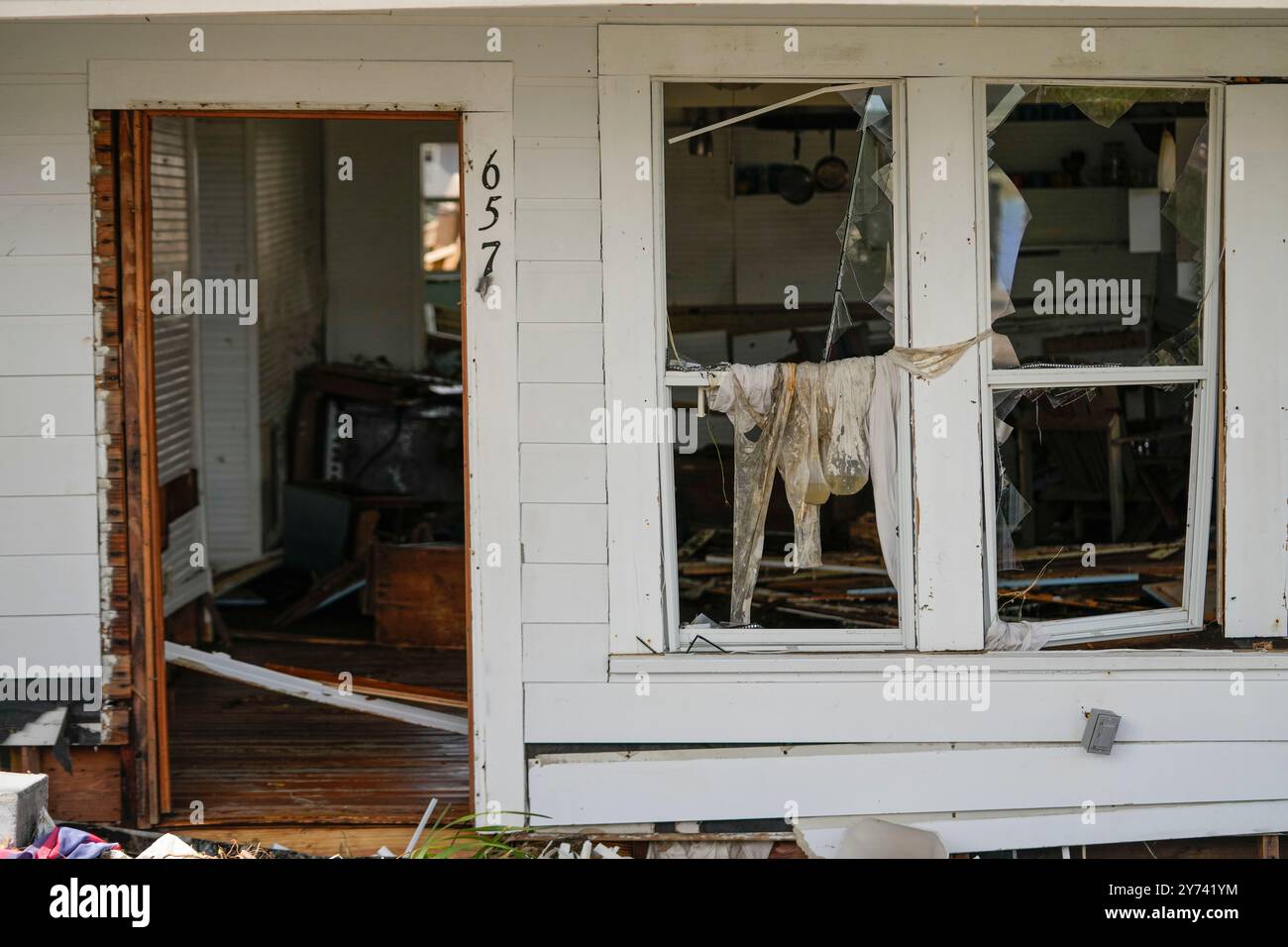 Heavy damage to a home that took on a storm surge is seen in the ...