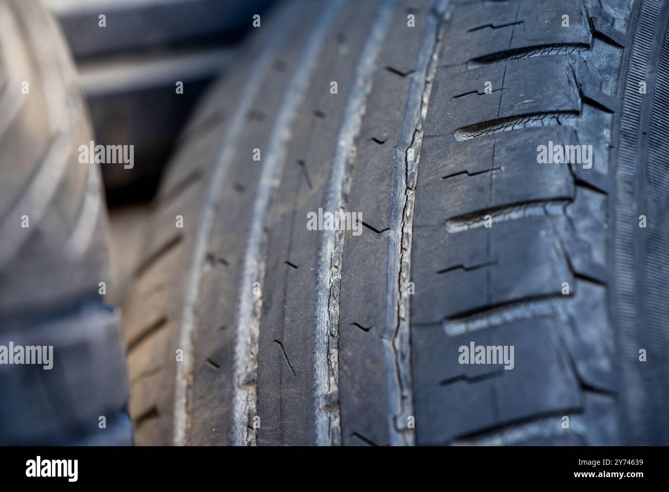 Worn and damaged tread of old tires lying in a landfill. Decreased road ...